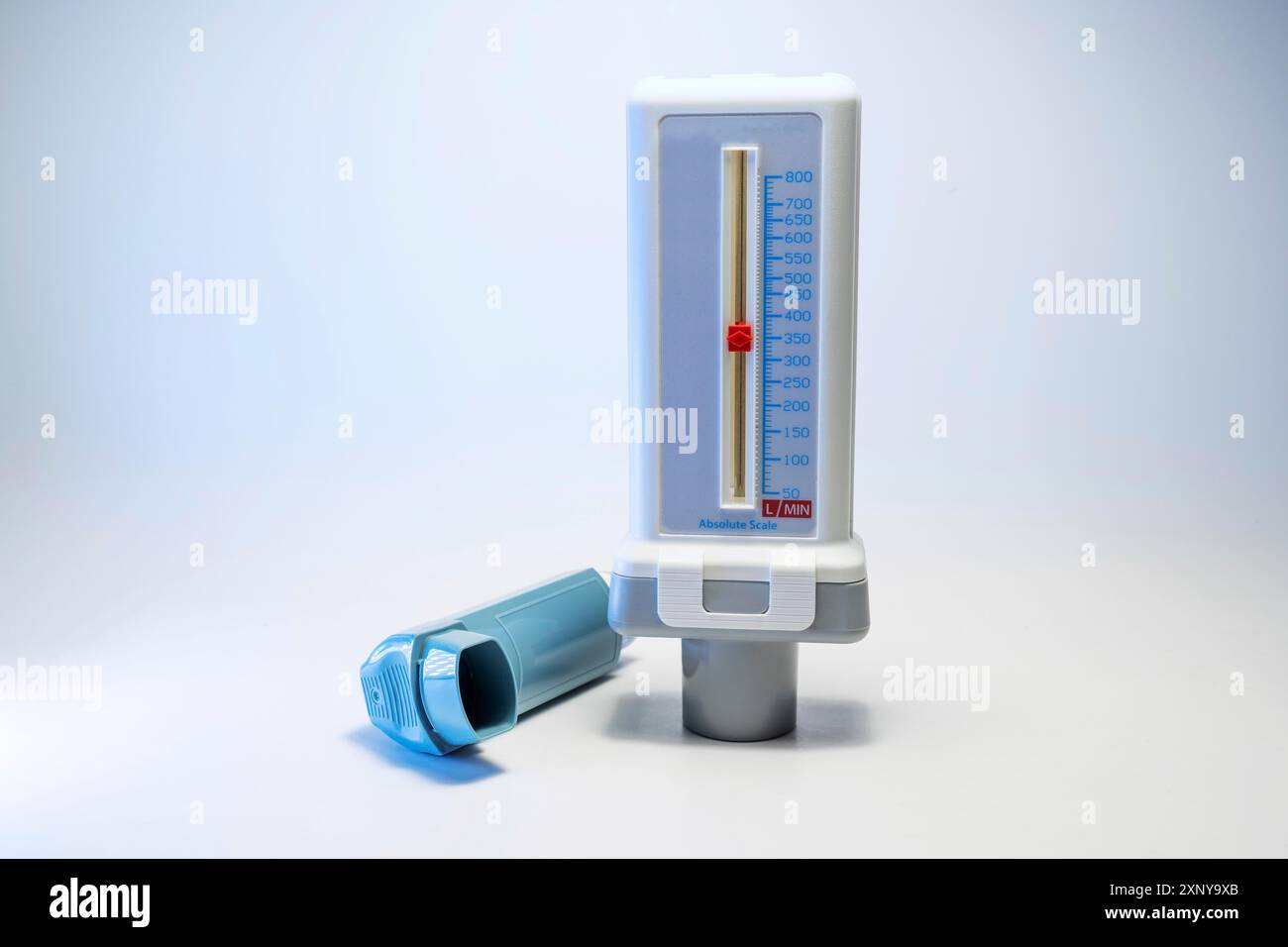 Peak Flow Meter And A Blue Inhaler Medical Devices For Patients With Asthma Allergy Or Copd