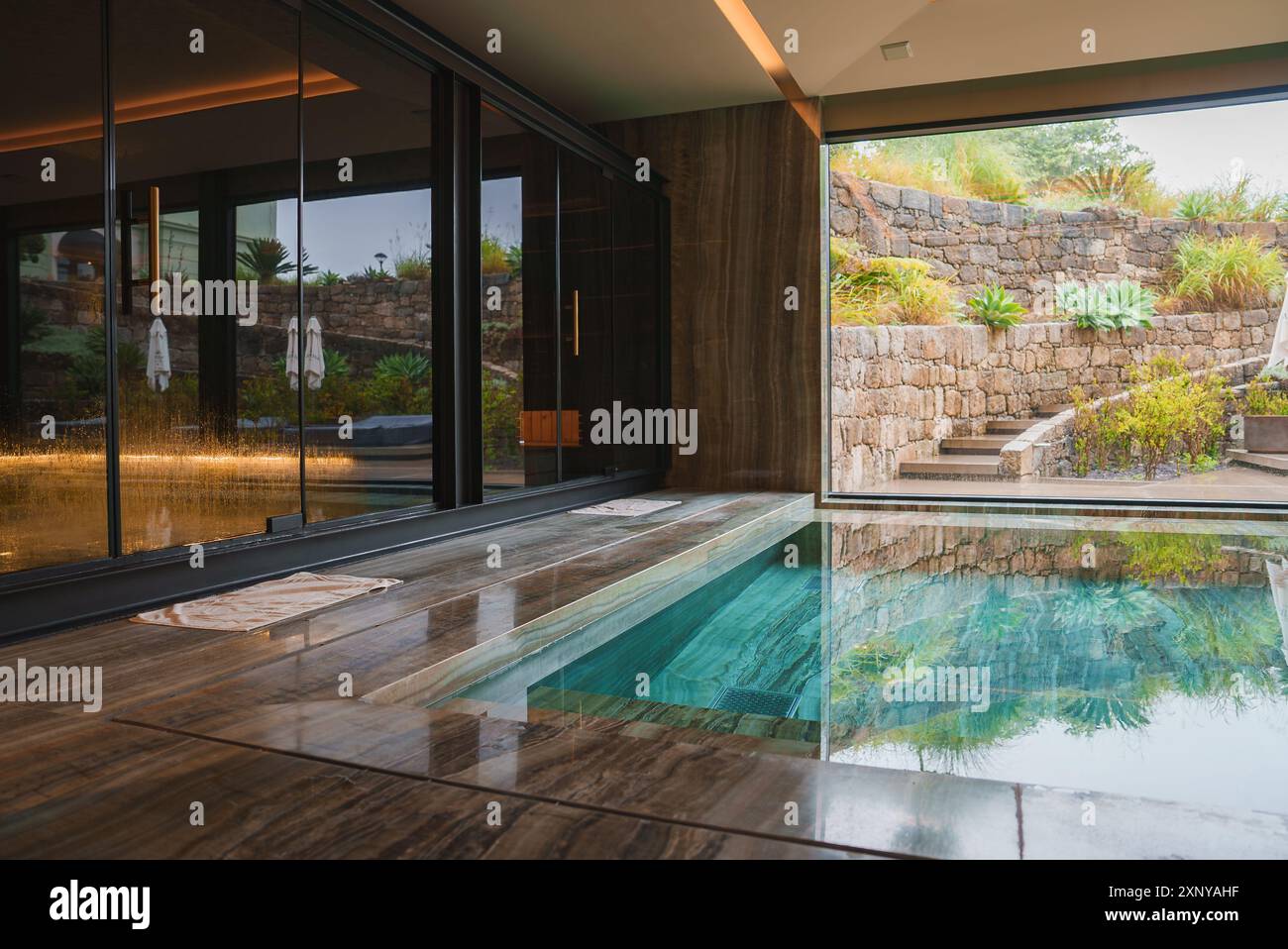 Luxurious Indoor Pool with Modern Design and Floor-to-Ceiling Glass ...