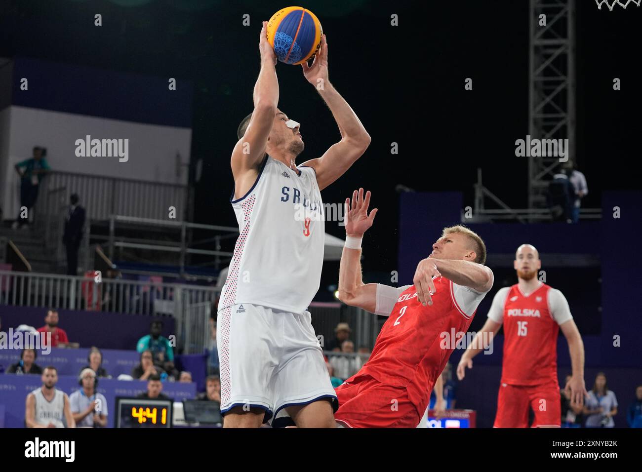 Serbia's Mihailo Vasic (9) shoots over Poland's Filip Matczak (2) in ...