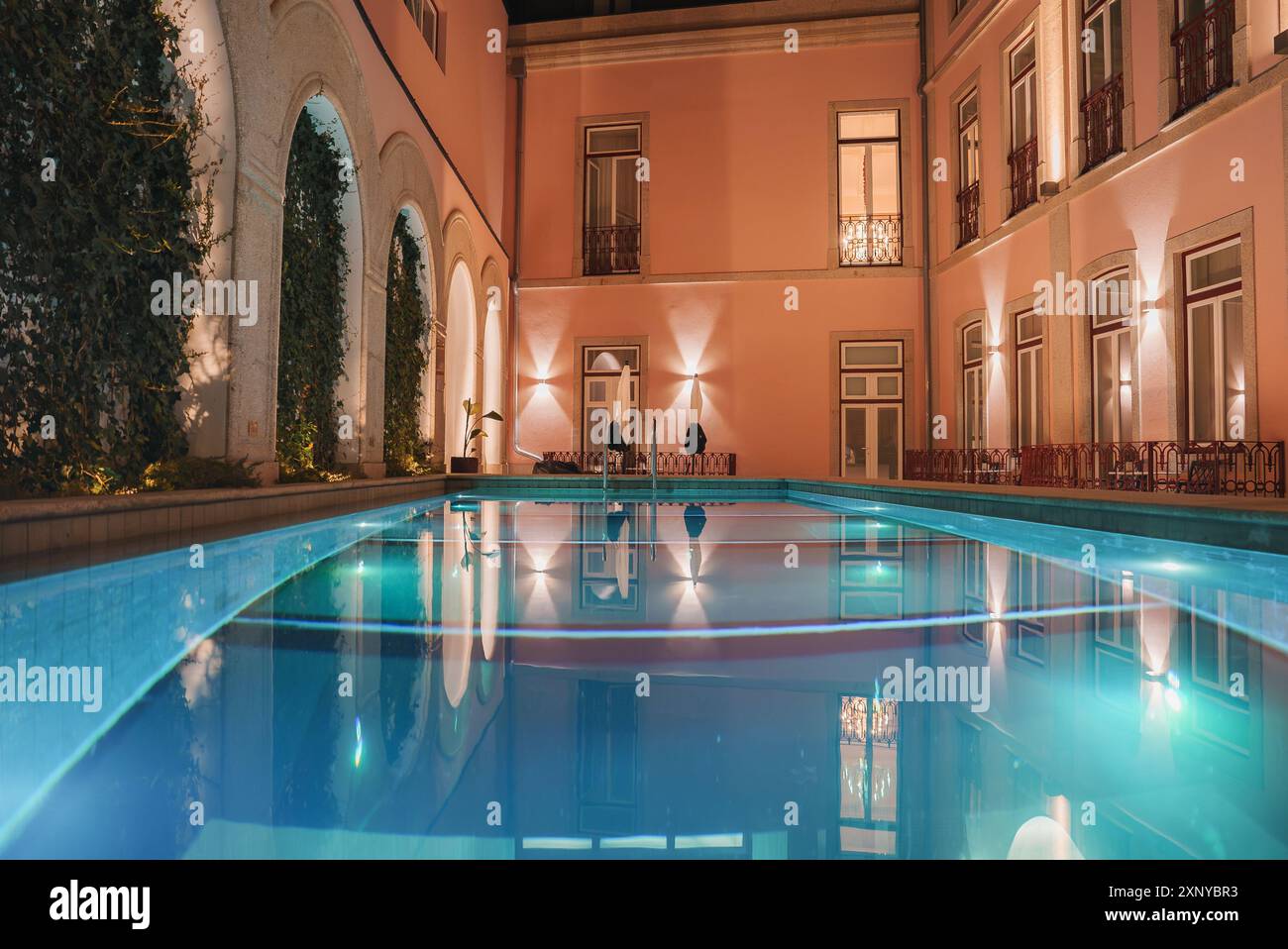 Luxurious Hotel Courtyard with Illuminated Swimming Pool at Night Stock ...