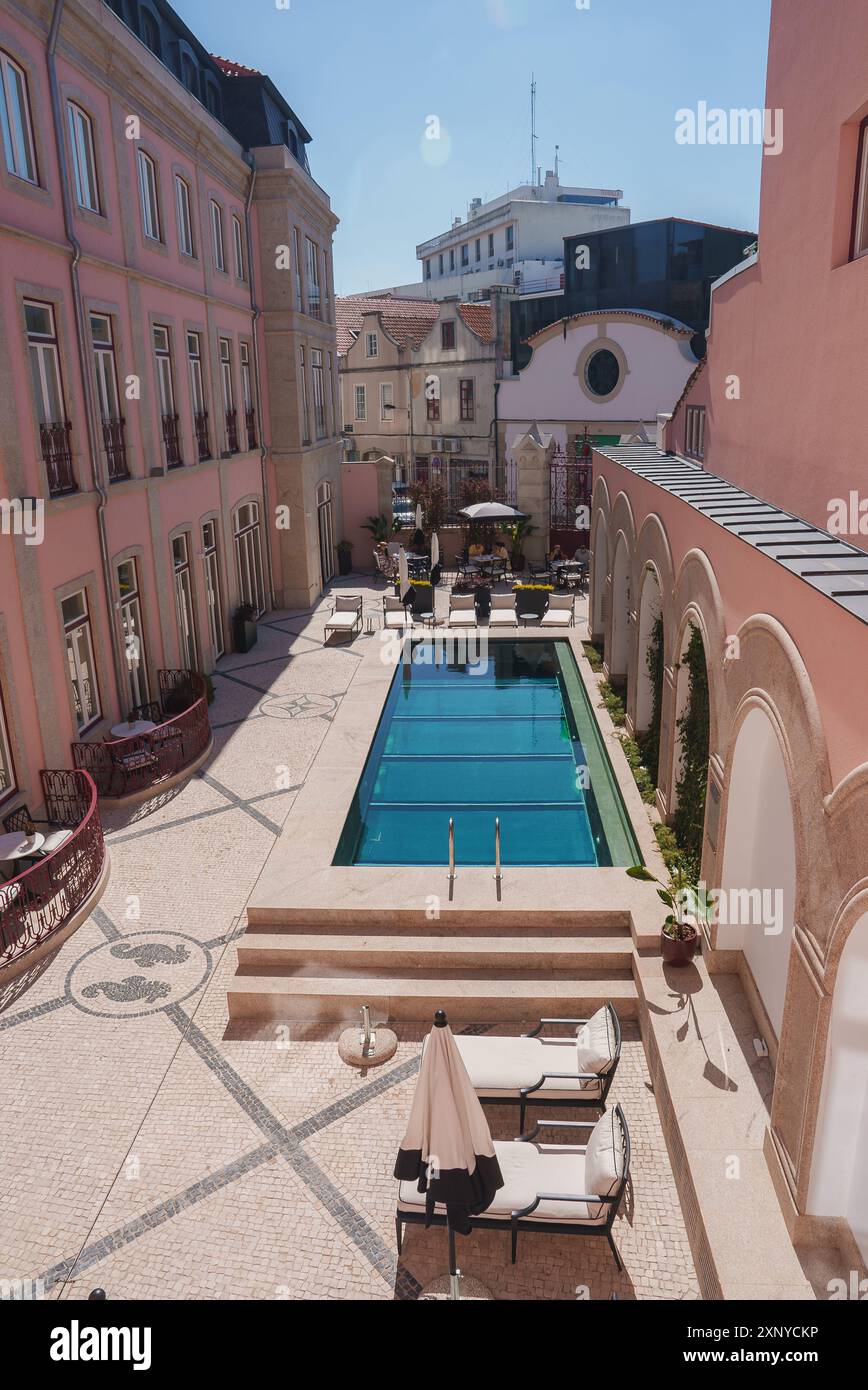 Luxurious Hotel Courtyard with Rectangular Pool and Elegant ...