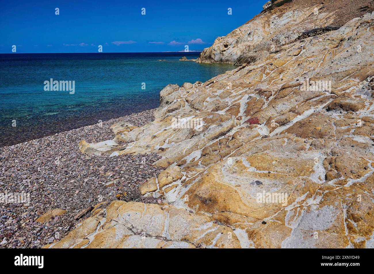 Coastal scene with rocks and blue water under a clear sky, Lambi beach ...