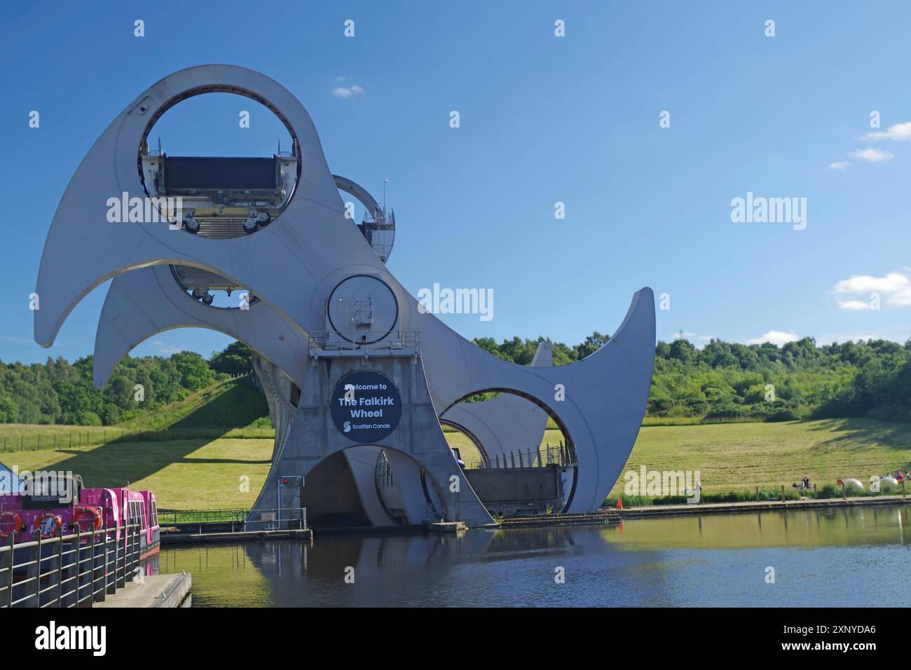 The Falkirk Wheel, a hydraulic structure, moves boats between two ...