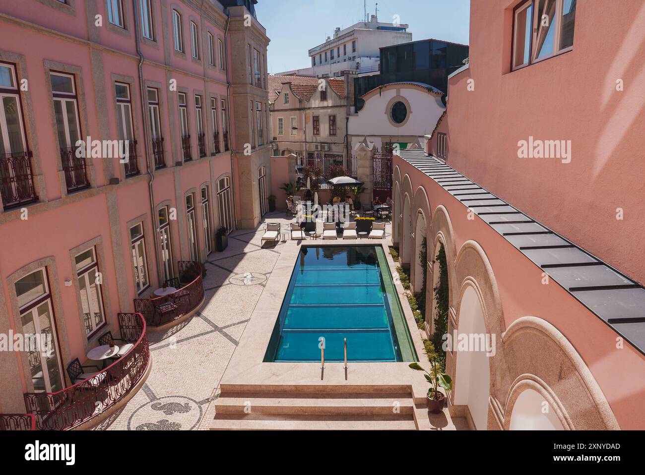 Luxurious Hotel Courtyard with Rectangular Pool and Elegant ...