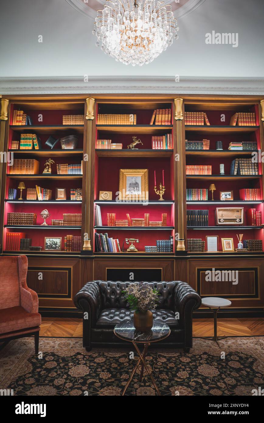 Luxurious Hotel Library with Ornate Bookshelf and Crystal Chandelier ...