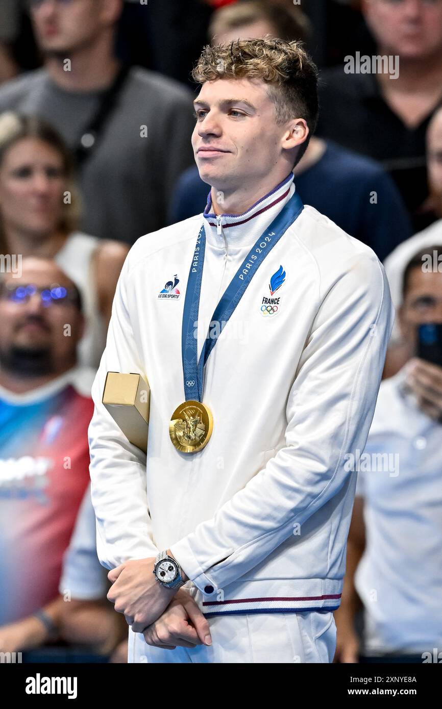 Paris, France. 02nd Aug, 2024. Leon Marchand of France stands with the ...