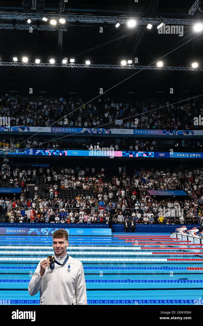 Paris, France. 02nd Aug, 2024. Leon Marchand of France shows the medal ...