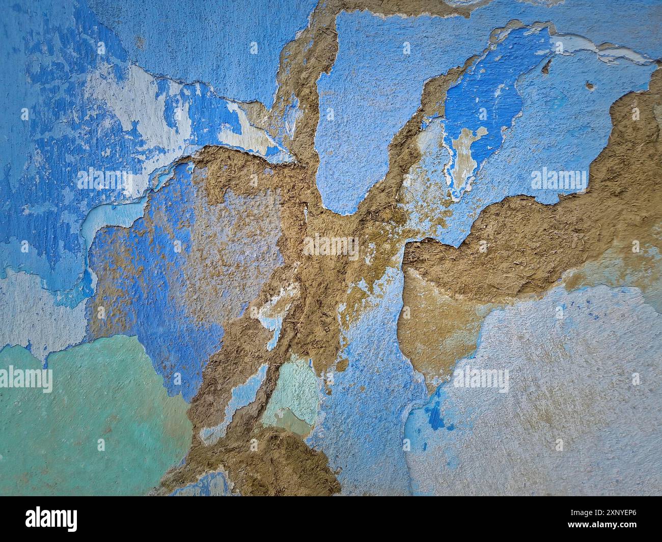 Old peeling wall with different layers of construction materials ...