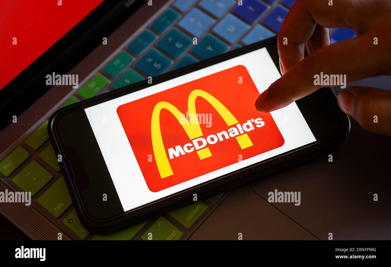 In this photo illustration, McDonald's logo is displayed on a ...
