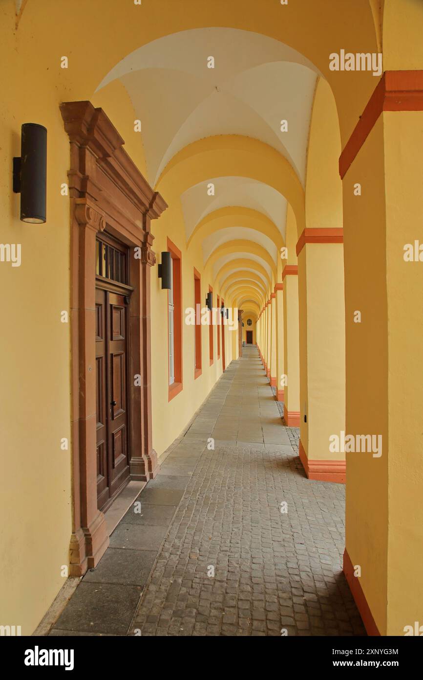 Yellow arcade from inside with archways and pillars, University, Lower ...