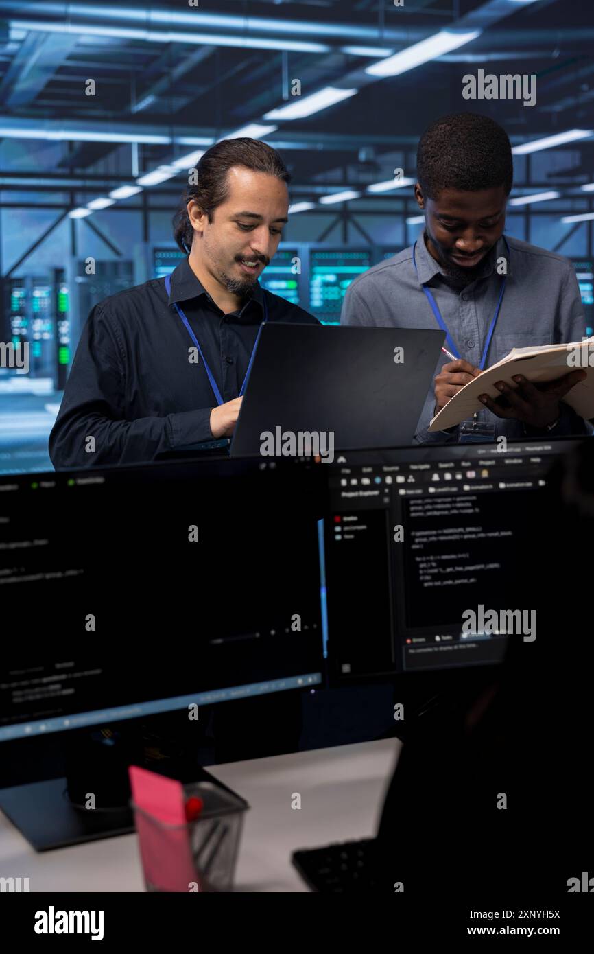 Happy engineers checking for signs of imminent failure in data center ...