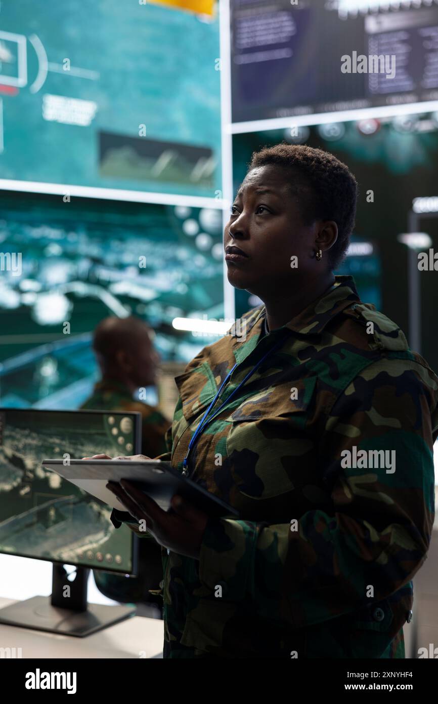 Woman recruit checking all surveillance footage from satellite CCTV ...