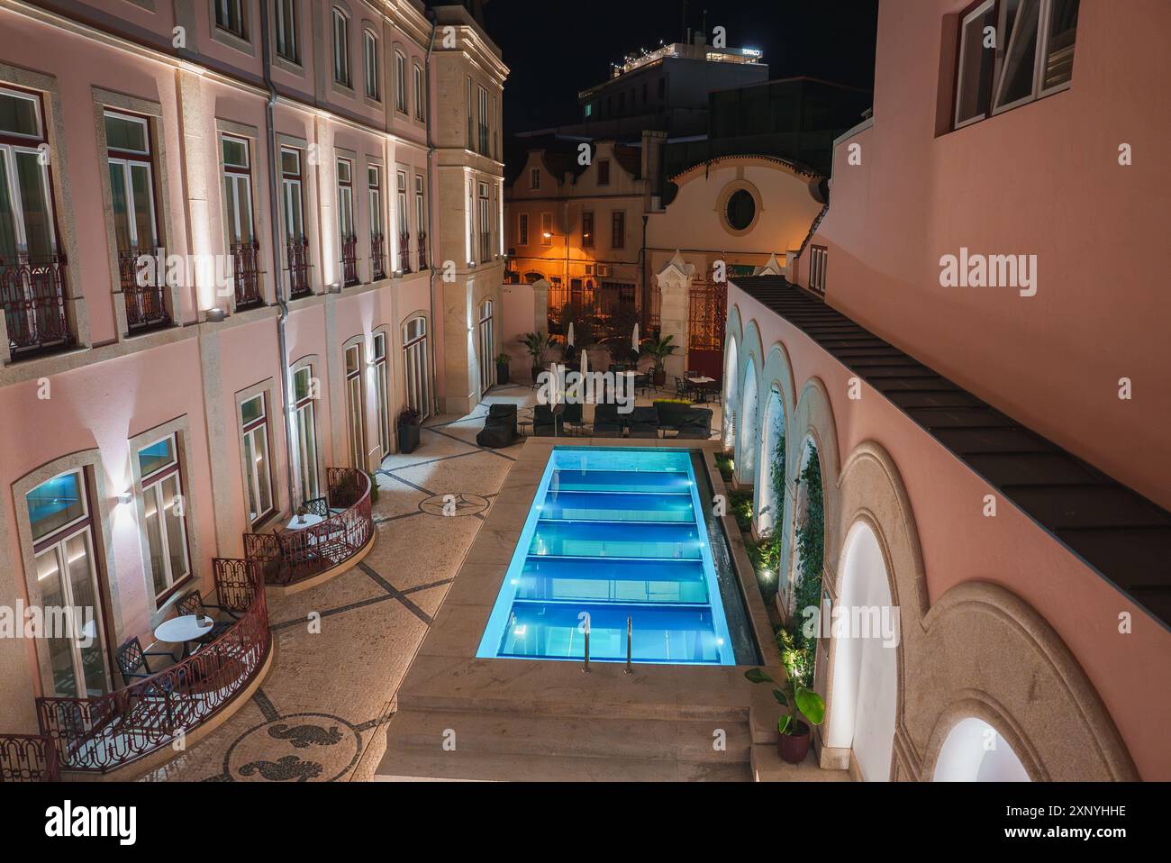 Luxurious Hotel Courtyard at Night with Illuminated Swimming Pool Stock ...