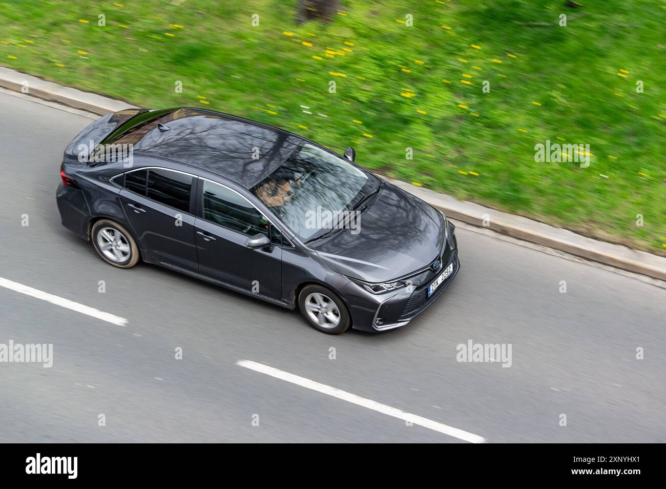 OSTRAVA, CZECH REPUBLIC - APRIL 4, 2024: Dark grey Toyota Corolla E210 ...