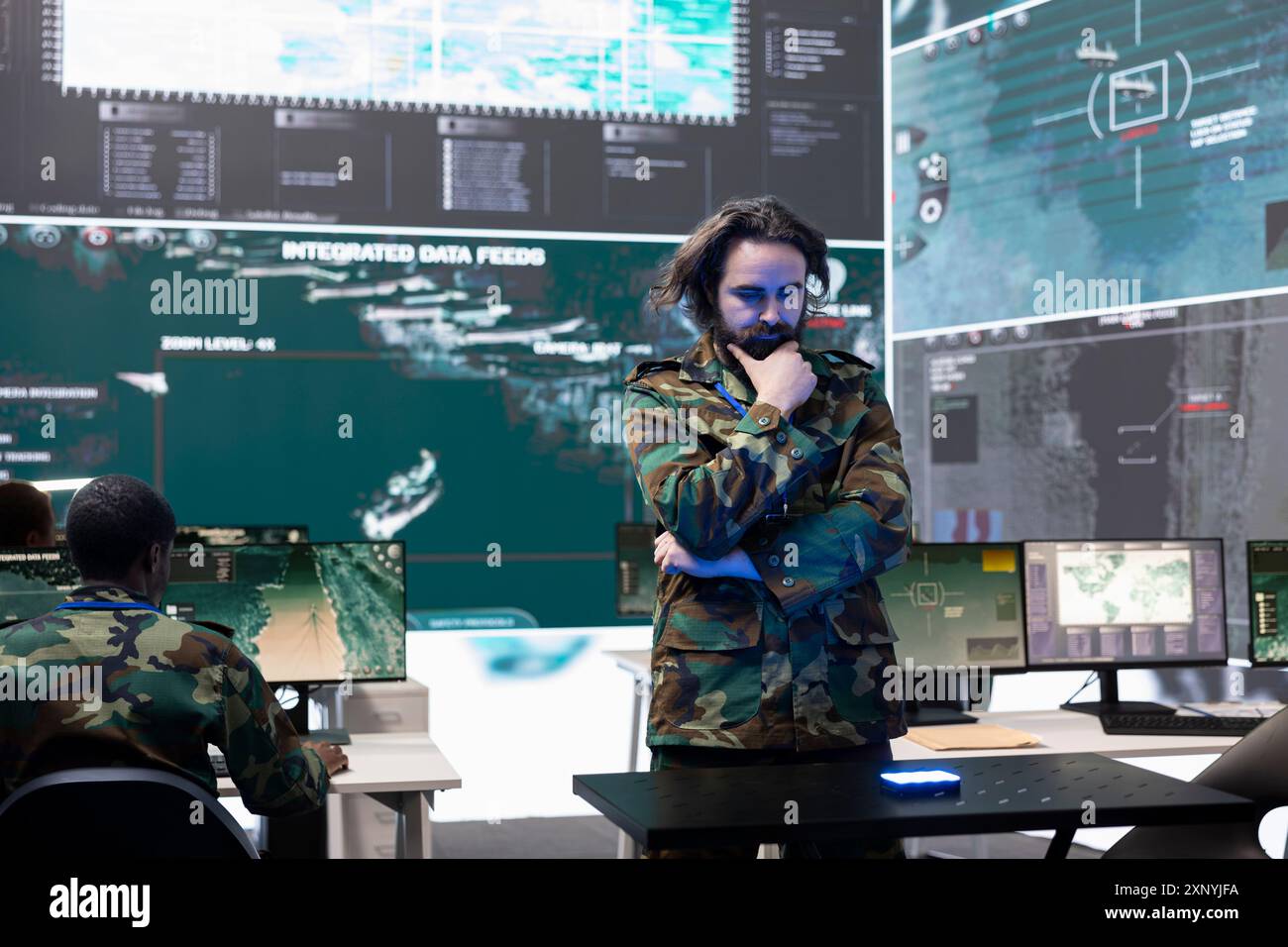 Military staff examining global satellite surveillance footage on a hologram, monitoring troops ...