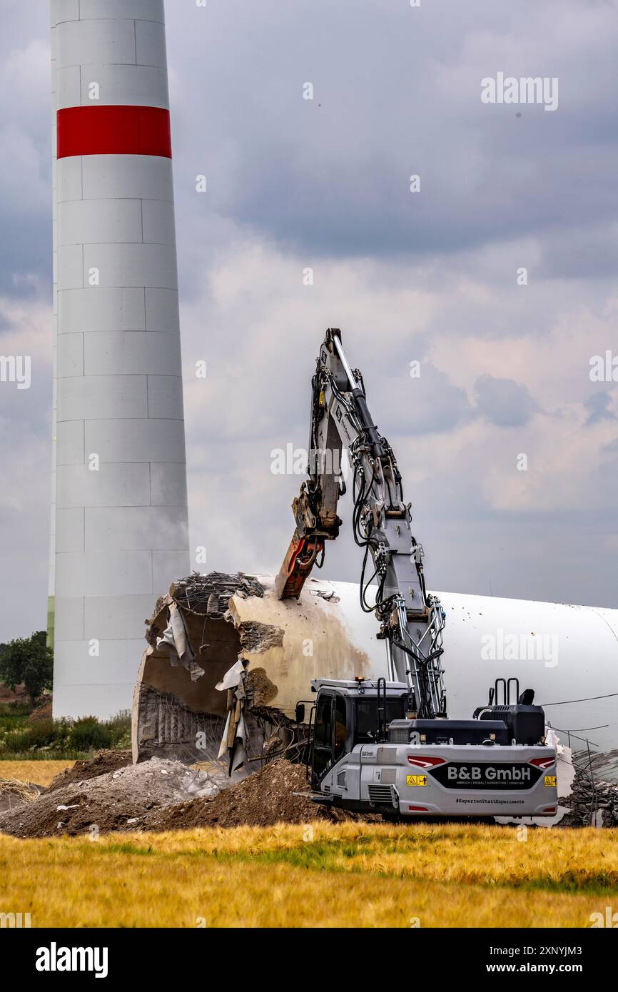 Demolished tower of a 20 year old wind turbine, in the Werl wind farm ...