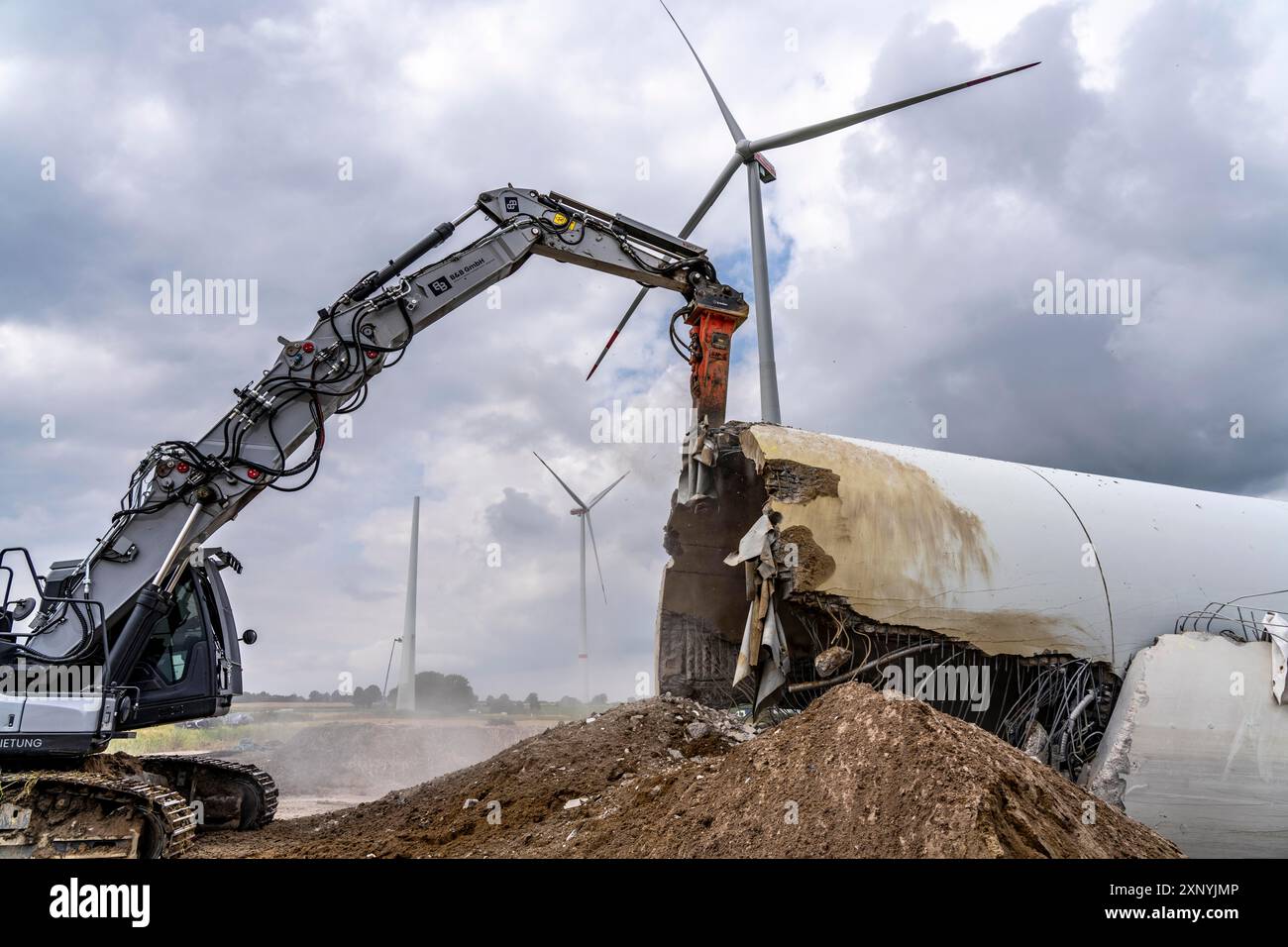 Demolished tower of a 20 year old wind turbine, in the Werl wind farm ...