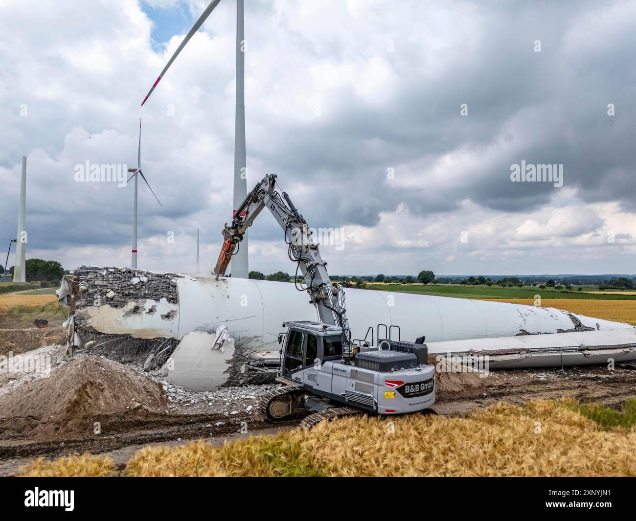 Demolished tower of a 20 year old wind turbine, in the Werl wind farm ...