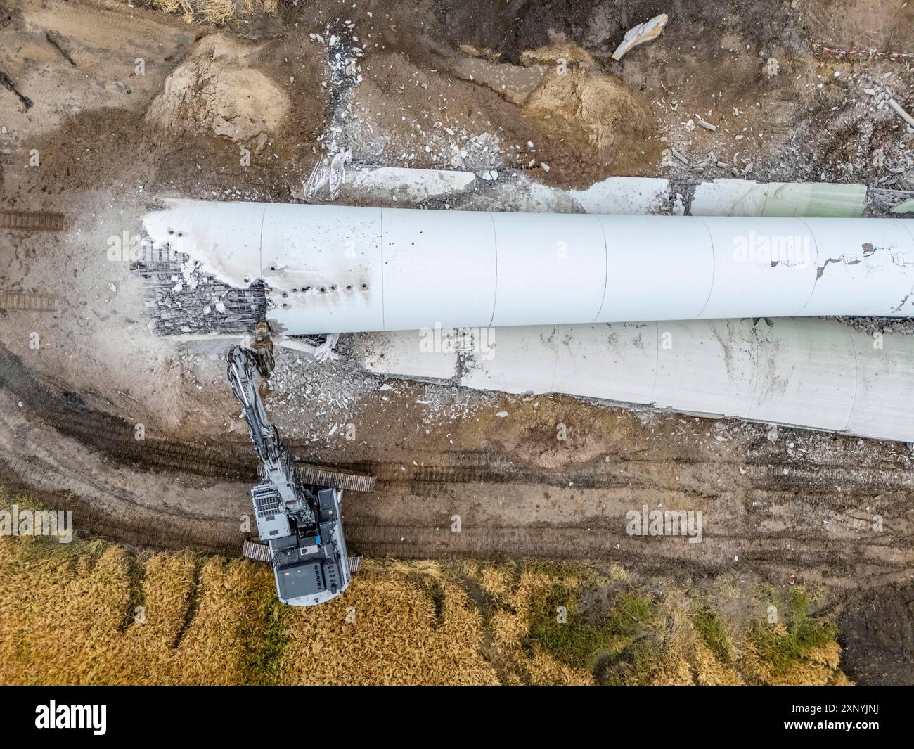 Demolished tower of a 20 year old wind turbine, in the Werl wind farm ...