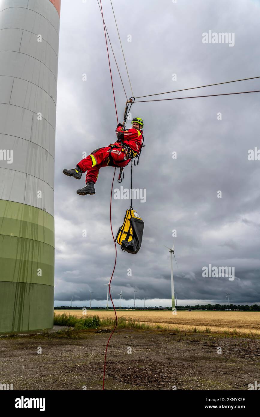 Height rescuers from the Oberhausen fire brigade practise abseiling ...