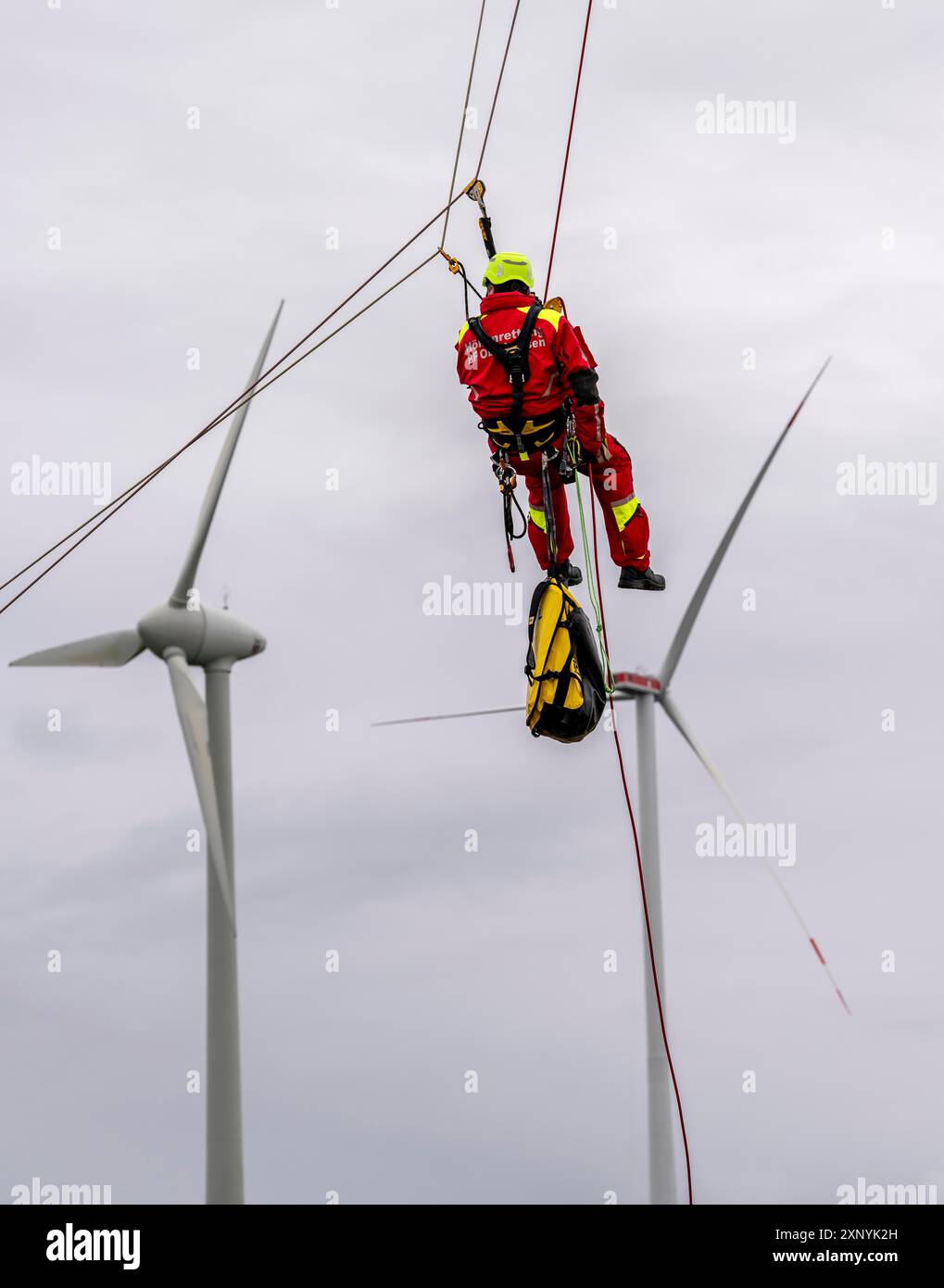 Height rescuers from the Oberhausen fire brigade practise abseiling ...