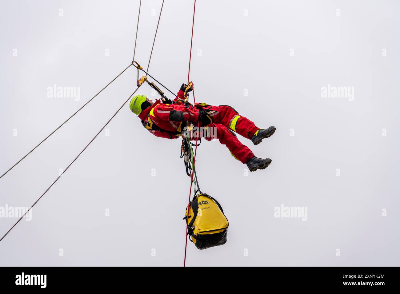 Height rescuers from the Oberhausen fire brigade practise abseiling ...