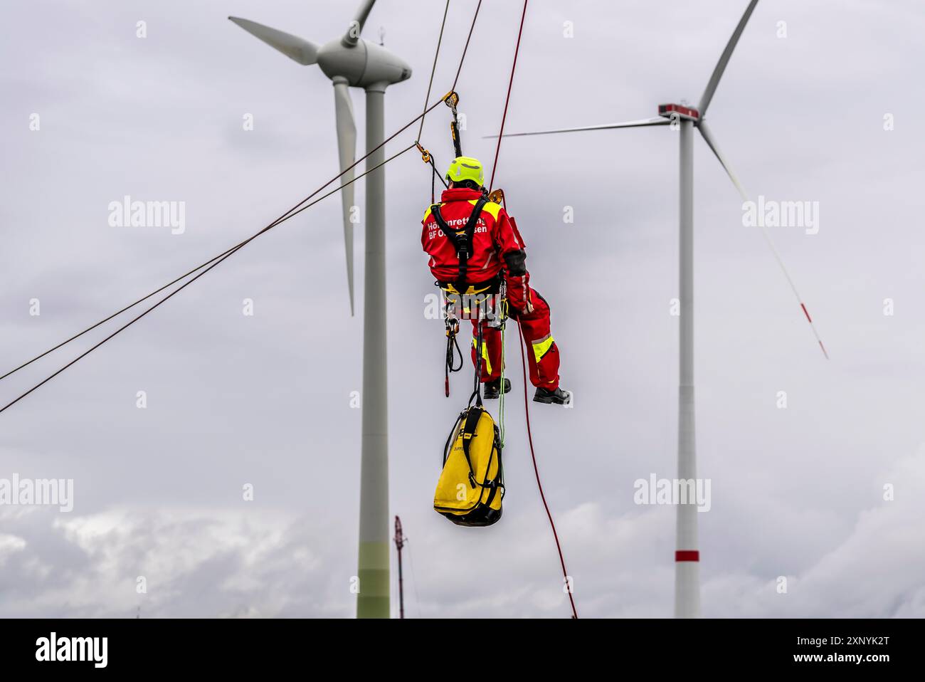 Height rescuers from the Oberhausen fire brigade practise abseiling ...