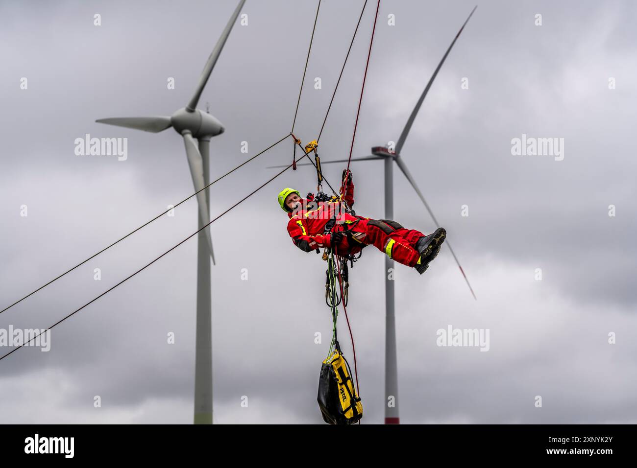 Height rescuers from the Oberhausen fire brigade practise abseiling ...