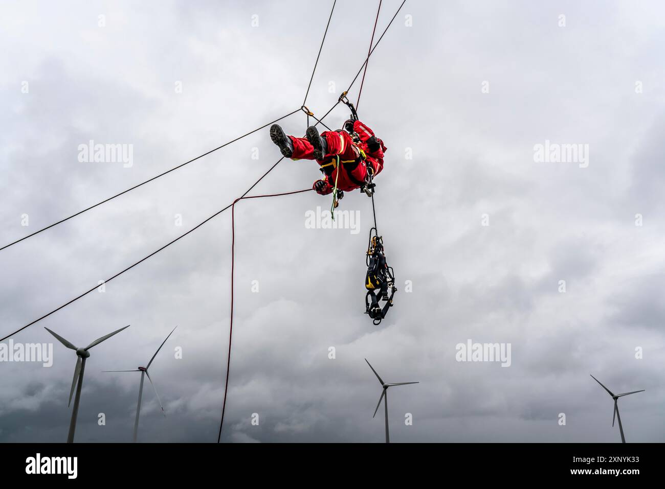 Height rescuers from the Oberhausen fire brigade practise abseiling ...