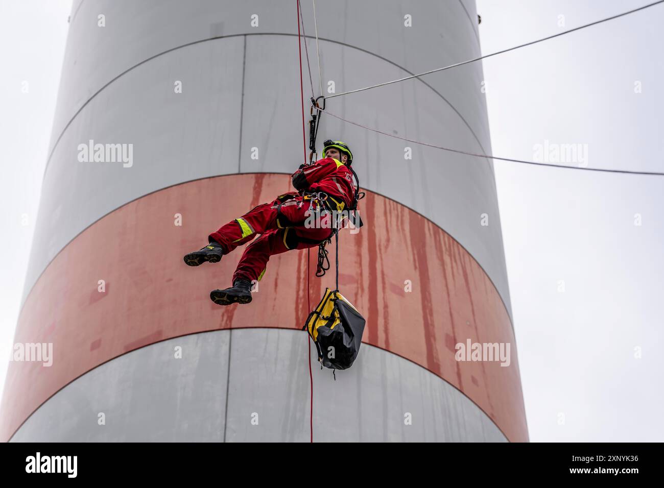 Height rescuers from the Oberhausen fire brigade practise abseiling ...