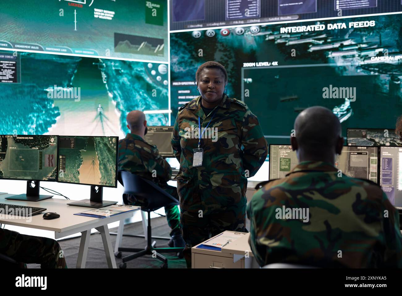 Female intelligence analyst managing the reconnaissance mission with ...