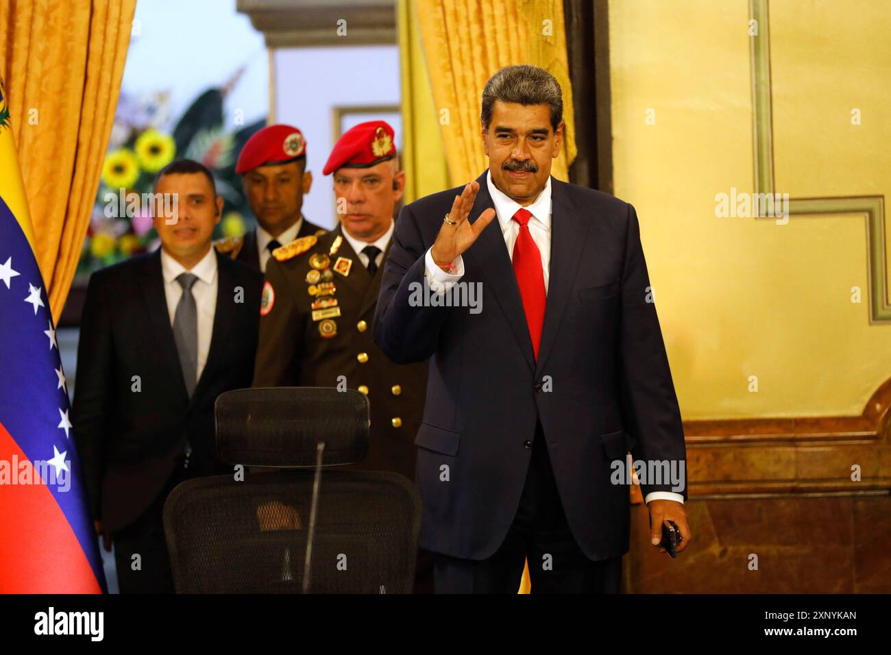 Venezuelan President Nicolas Maduro greets reporters as he arrives for ...
