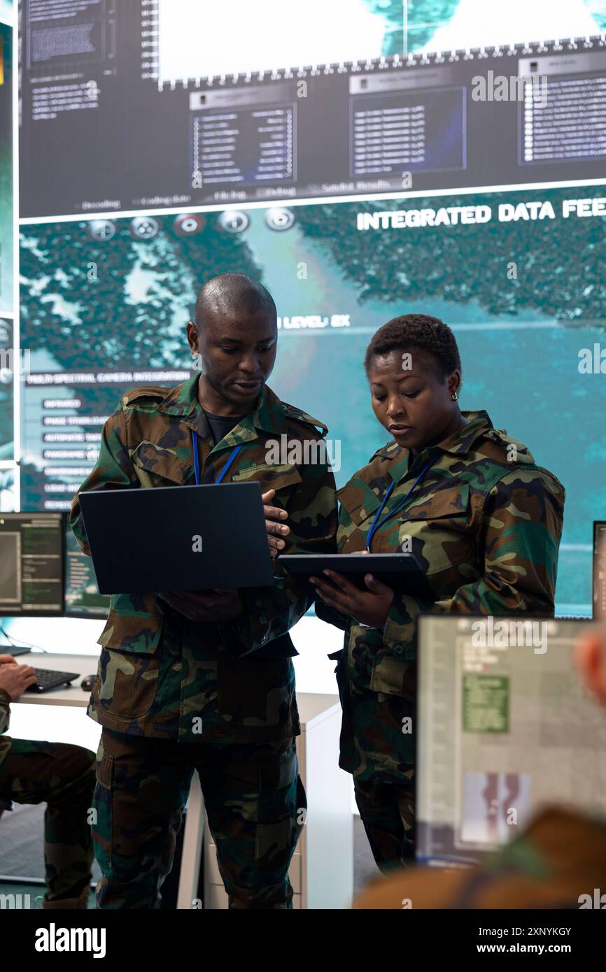 Soldiers team managing air traffic control for military aircrafts ...