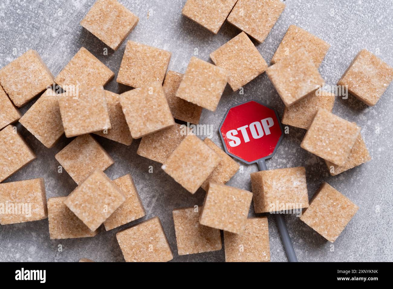 Sugar cubes and stop sign on gray background, top view Stock Photo - Alamy