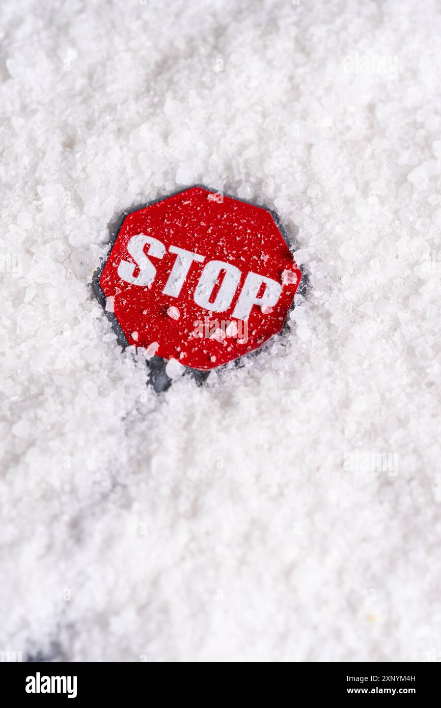 Stop sign on background white salt. Conceptual image stop salt Stock ...