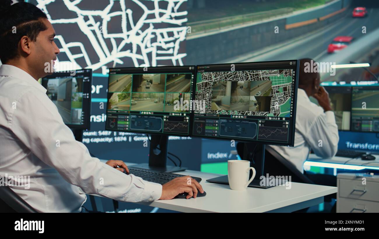 Team of employees monitoring delivery trucks with gps coordinates on ...