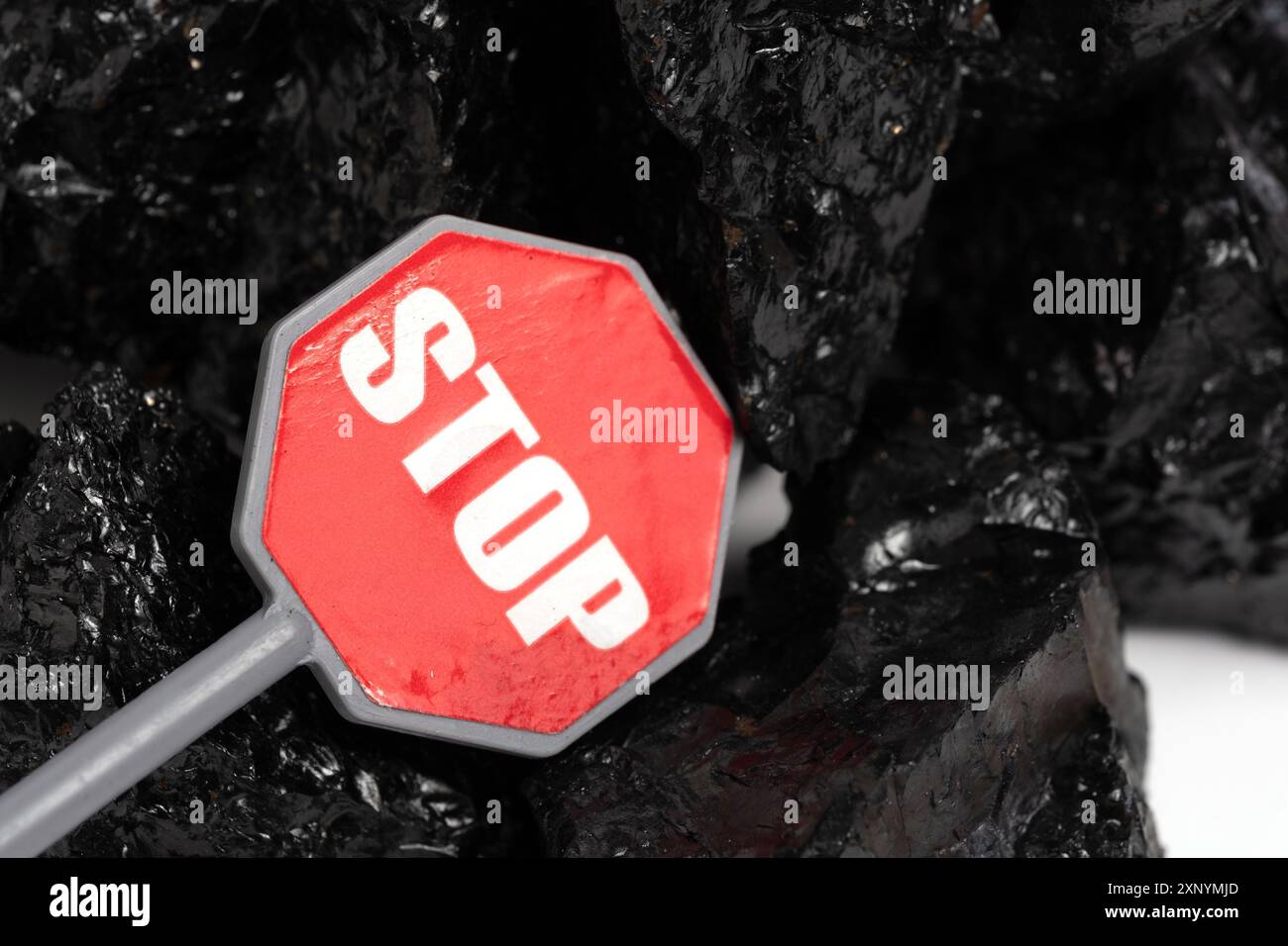 Stop sign on coal background. Conceptual image of danger and caution ...