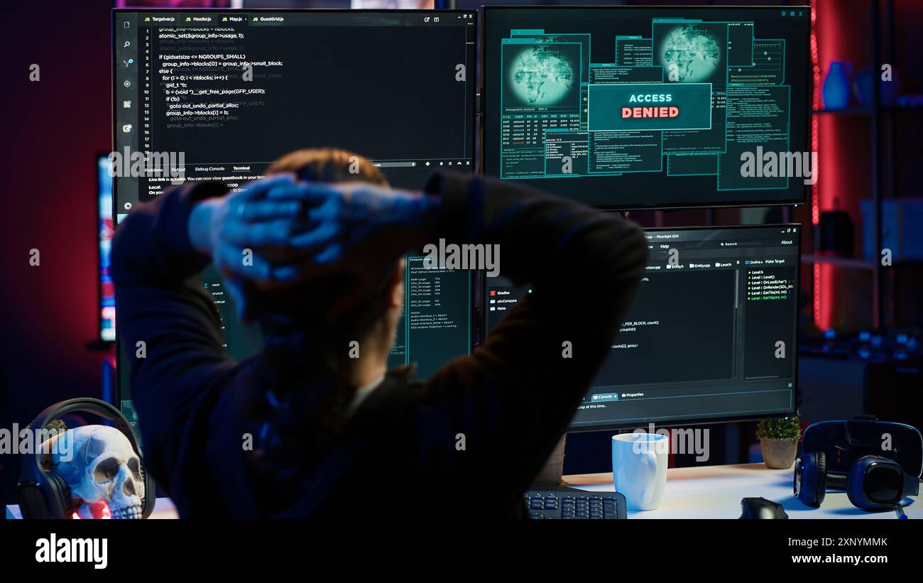 Hacker in hidden apartment trying to steal valuable data by targeting ...