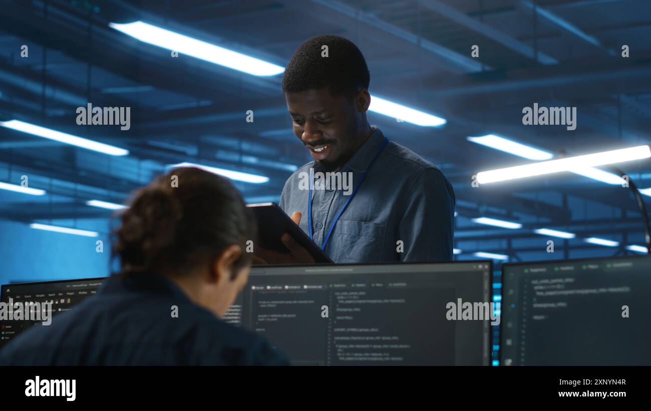 Manager Overseeing Team And Doing System Analysis Of Server Farm Supercomputers Using Tablet