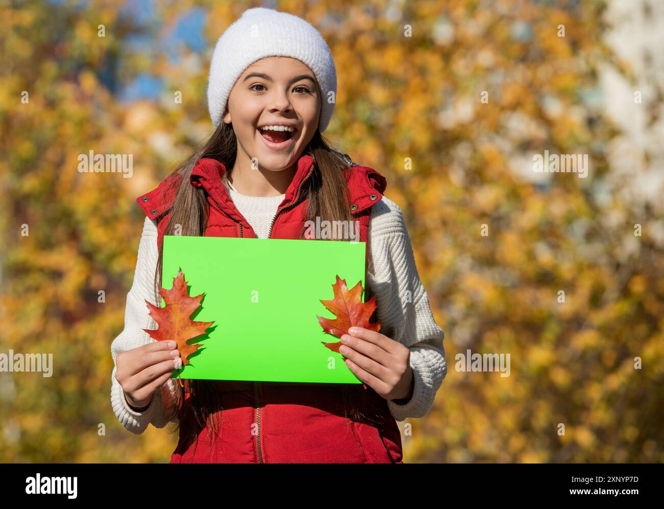 teenage girl in autumn with paper. girl hold blank paper for ...