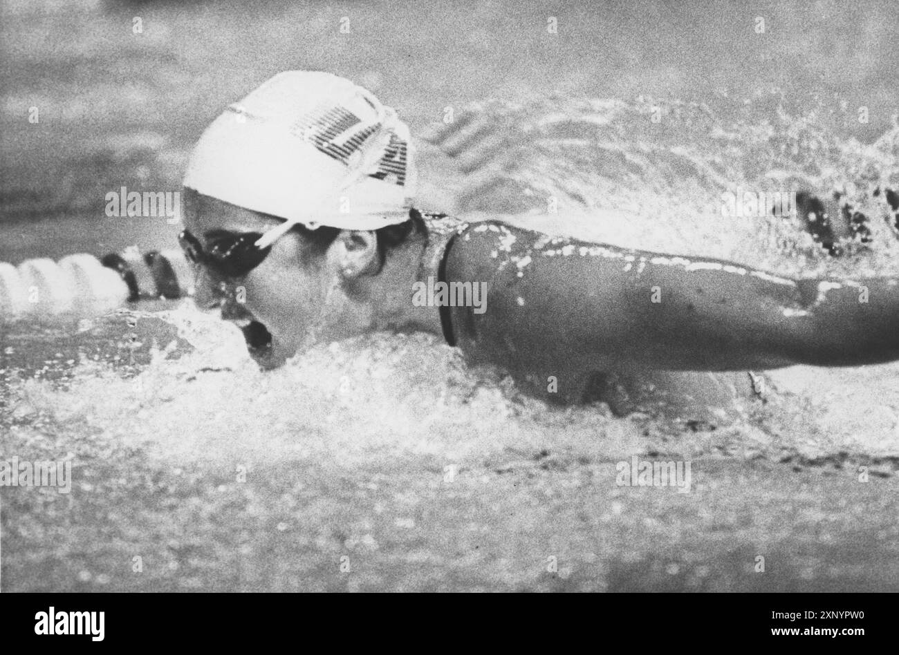 Swimmer wearing swim cap Black and White Stock Photos & Images - Alamy