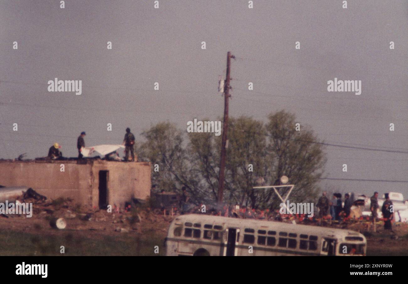 Waco Texas USA, April 1993: Investigators comb through the wreckage of ...