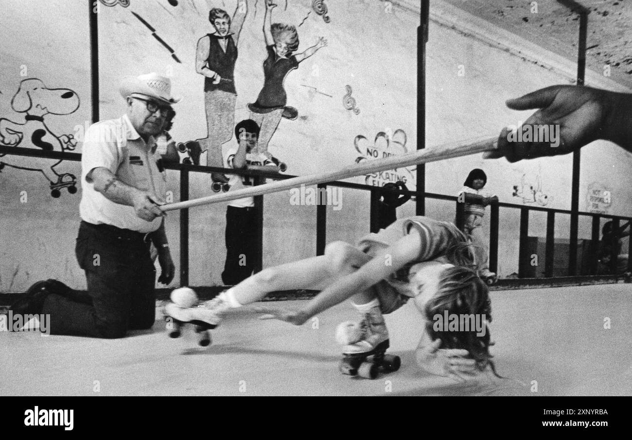 Limbo stick Black and White Stock Photos & Images - Alamy