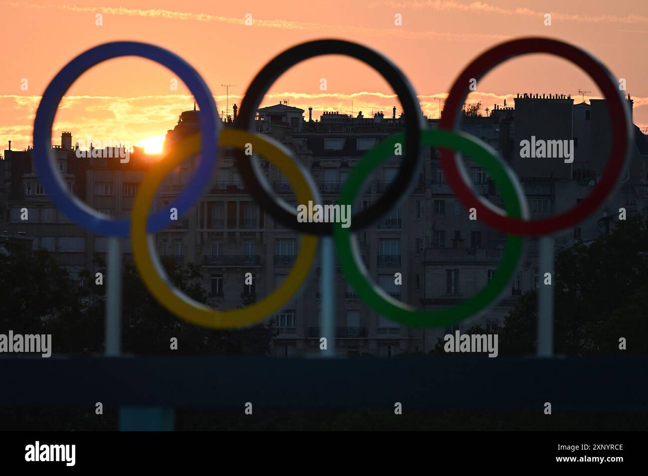 Paris, Fra. 03rd Aug, 2024. The sun sets behind the Olympic Rings at ...