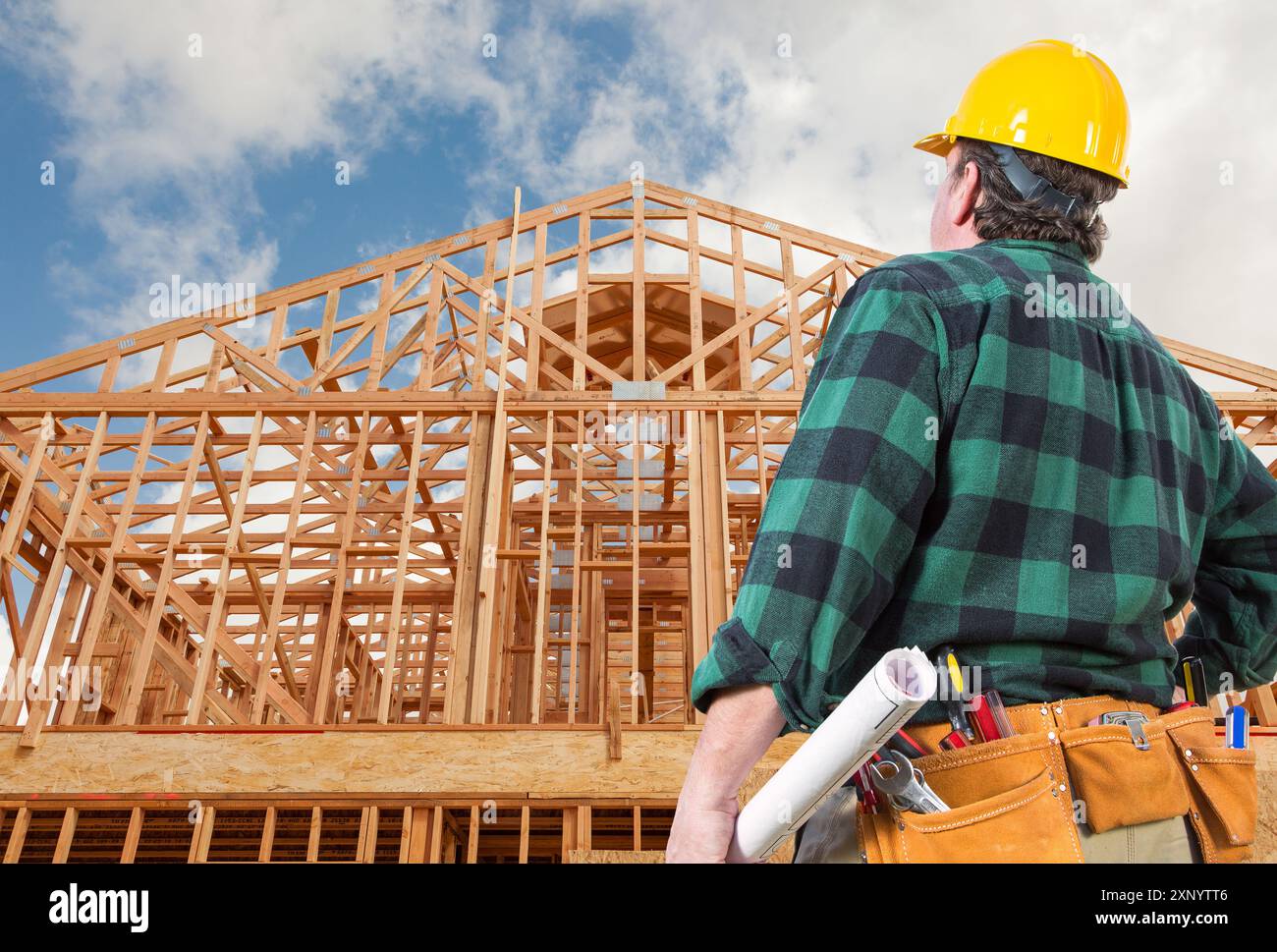 Contractor Wearing Hard Hat Standing In Front of New House Wood Framing ...