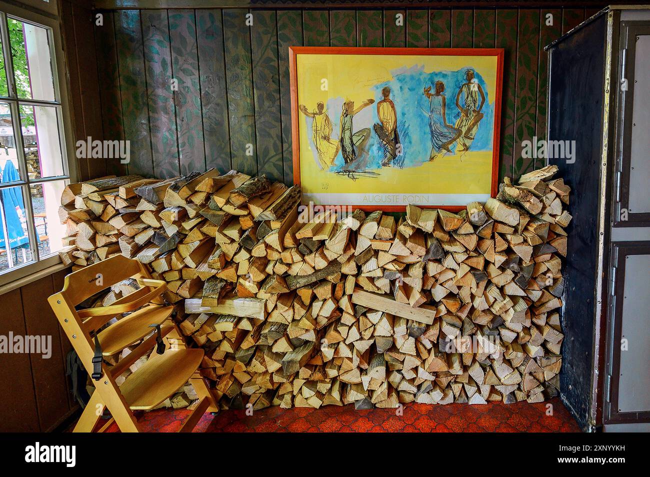 Storeroom with woodpile and Auguste Rodin Exhibition Poster M.R. 4517 ...