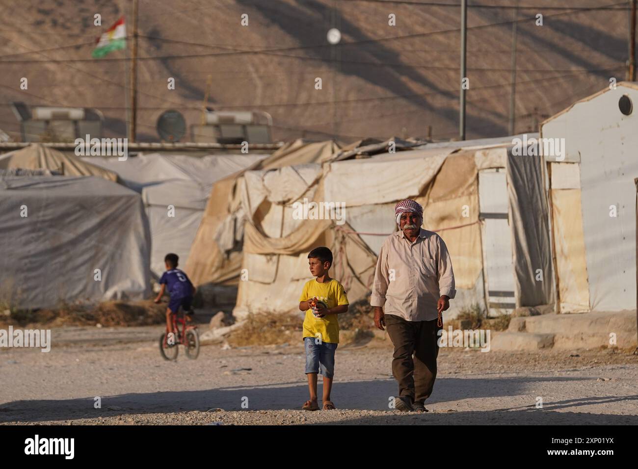 Iraqi Yazidi displaced people walk in Sharya camp, Yazidi internally ...