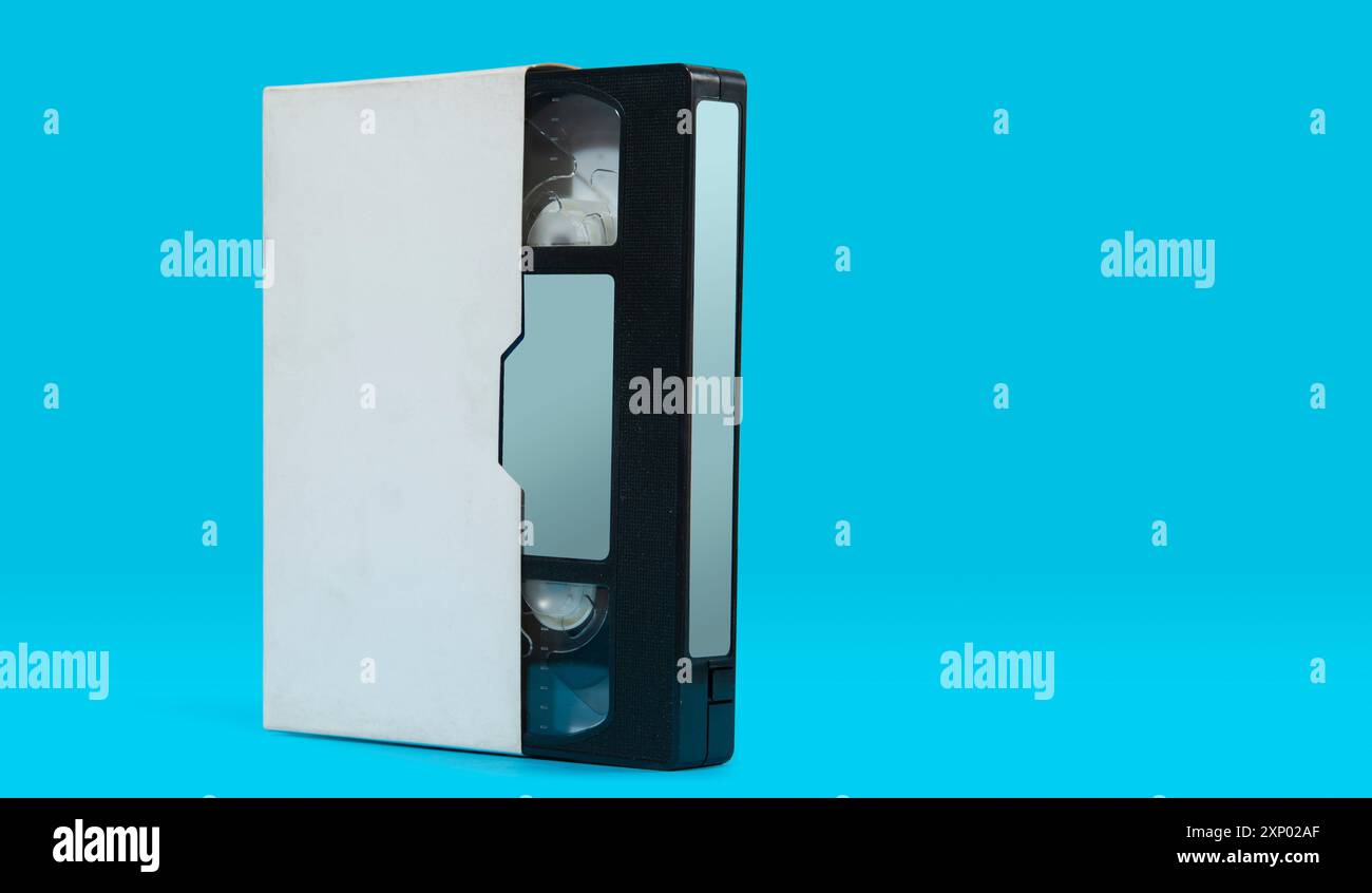 Front view of old black plastic VHS video cassette with white case on a ...