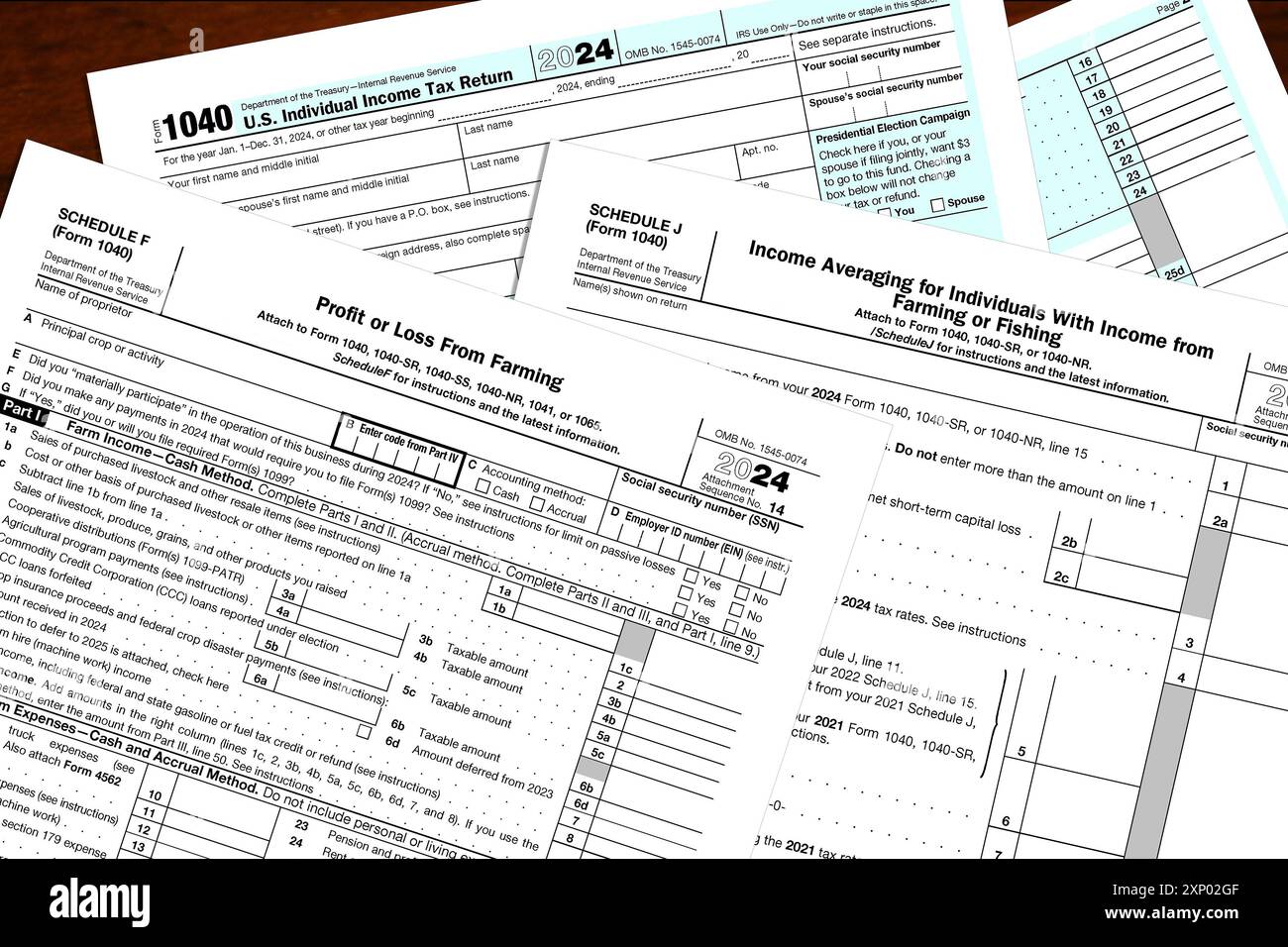 2024 IRS farming tax forms lay on a desktop Stock Photo - Alamy