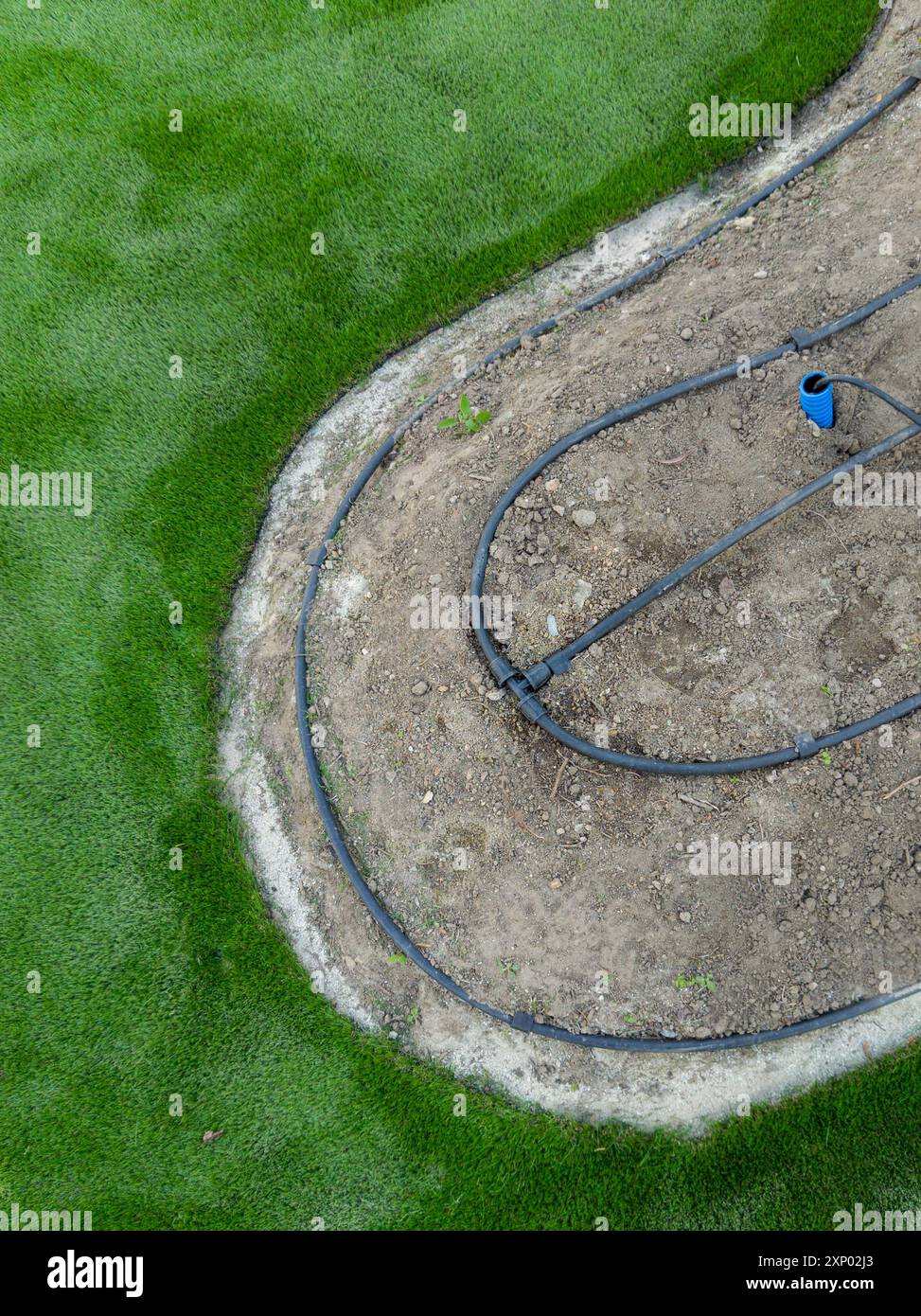 Visible Garden Irrigation System Installation Stock Photo - Alamy